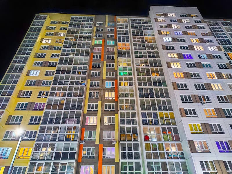 The Facade of a Multi-storey Building with Multi-colored Windows at ...