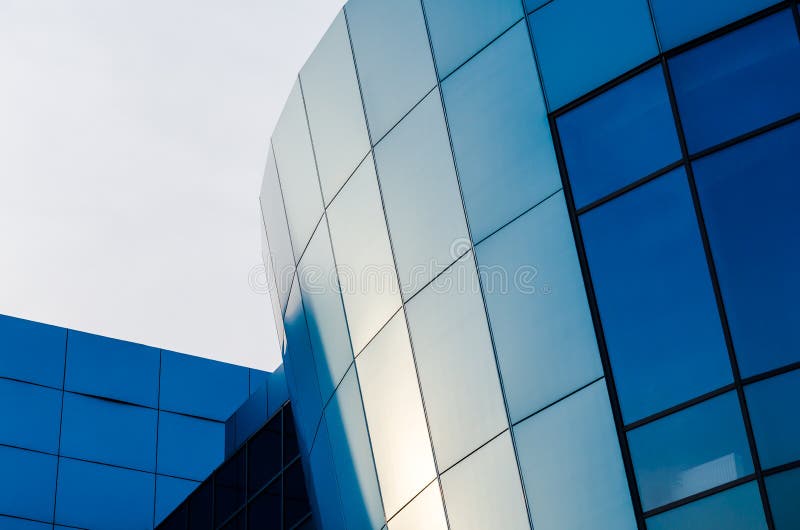 Mirrored Windows of the Facade of an Office Building with Blue Panels ...