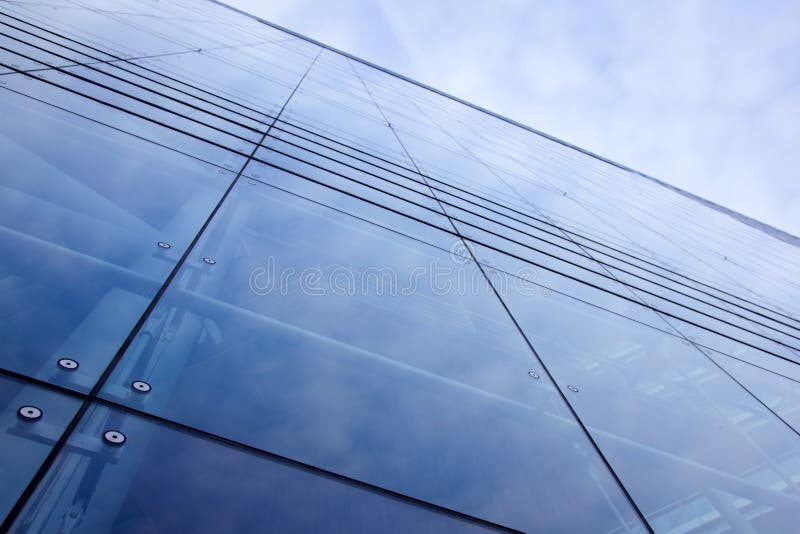 Facade of Office Building with Overcast Sky Reflected Stock Image ...