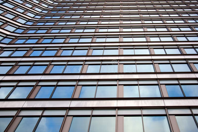 Facade of Office Building with Overcast Sky Reflected Stock Photo ...