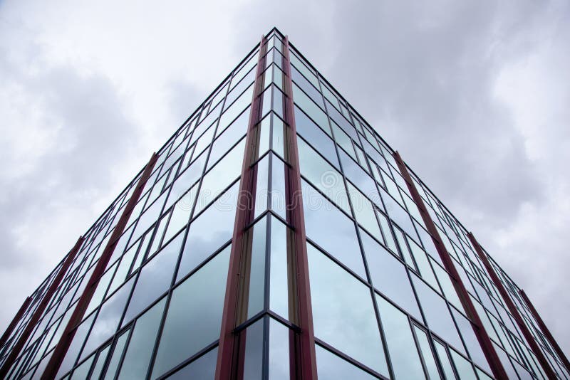 Facade of Office Building with Overcast Sky Reflected Stock Photo ...