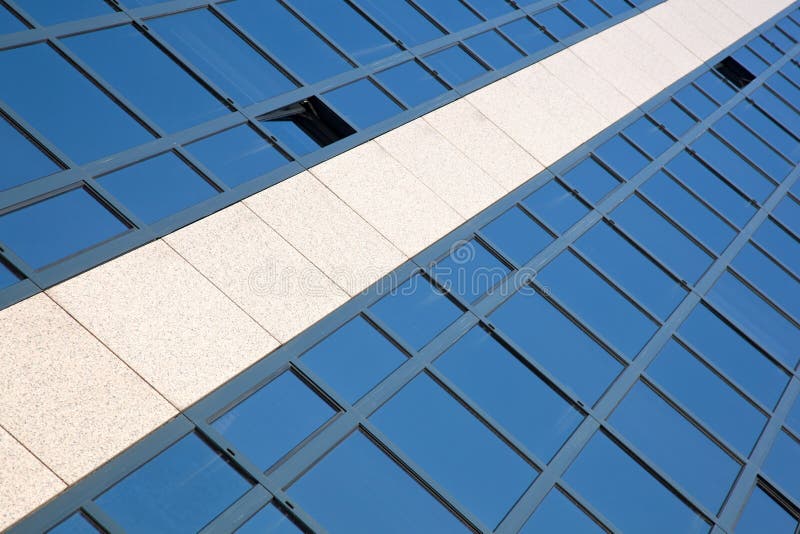 Facade of Office Building with Overcast Sky Reflected Stock Photo ...