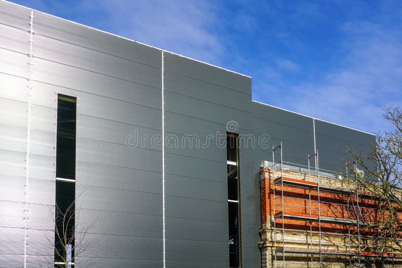 The Facade of an Old Brick House is Integrated into a New Modern ...