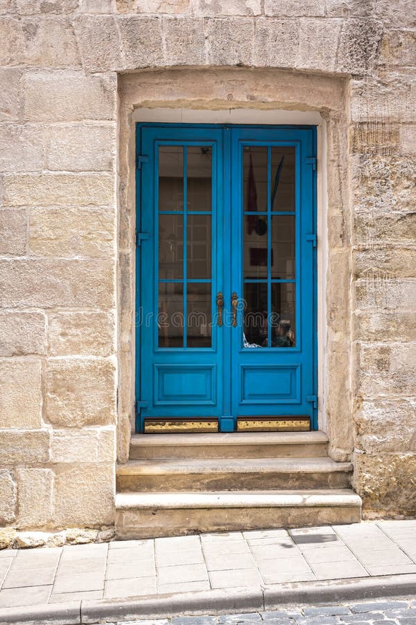Facade of an Old Building with Blue Doors. Stock Image - Image of ...