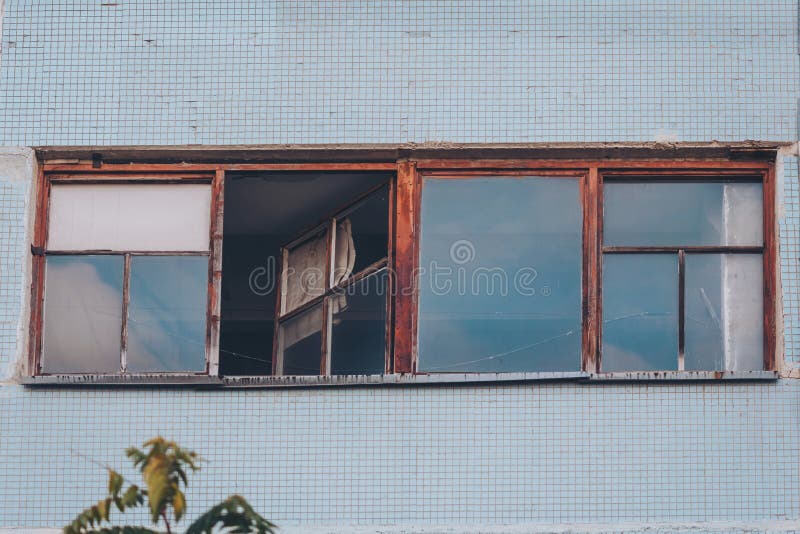 Facade of an Old Building. a View of Broken Windows in an Abandoned ...