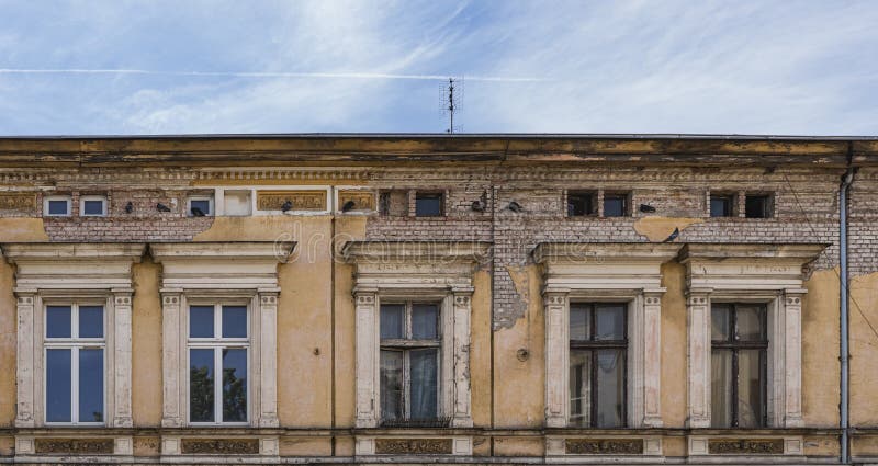 Facade of Old and Damaged Building with Falling Off Plaster Stock Photo ...