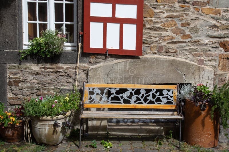 Facade of an Old House with Flowers and a Bench in Front Stock Image ...