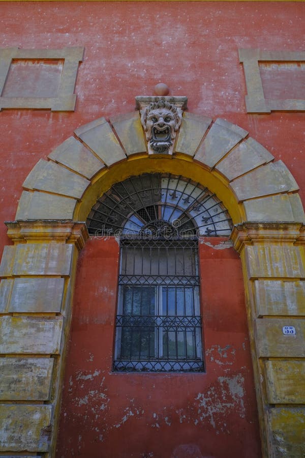 Facade of the Red Building with Doors, Windows and Shutters and Monster ...