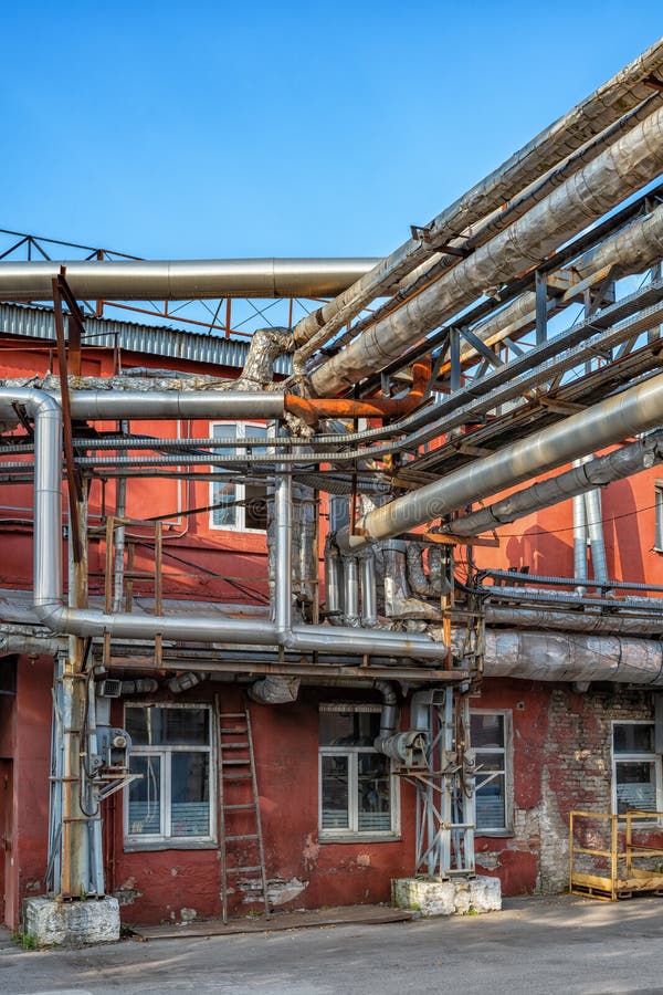 The Facade of the Red Building of an Old Industrial Complex Stock Photo ...