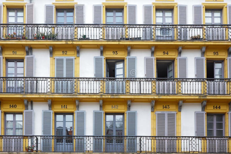 Facade of a Residential Building with Continuous Balconies and Numbered ...