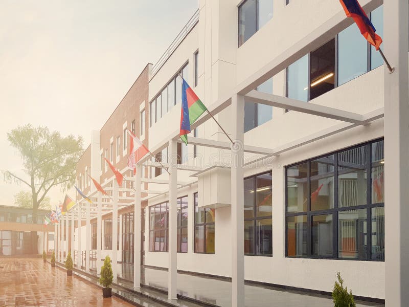 Facade of the School Building with Flags Outdoors Stock Photo - Image ...