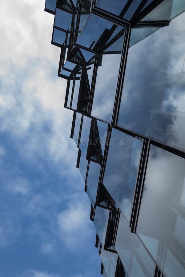 Facade of a Skyscraper Building with a Glassy View of the Sky and ...