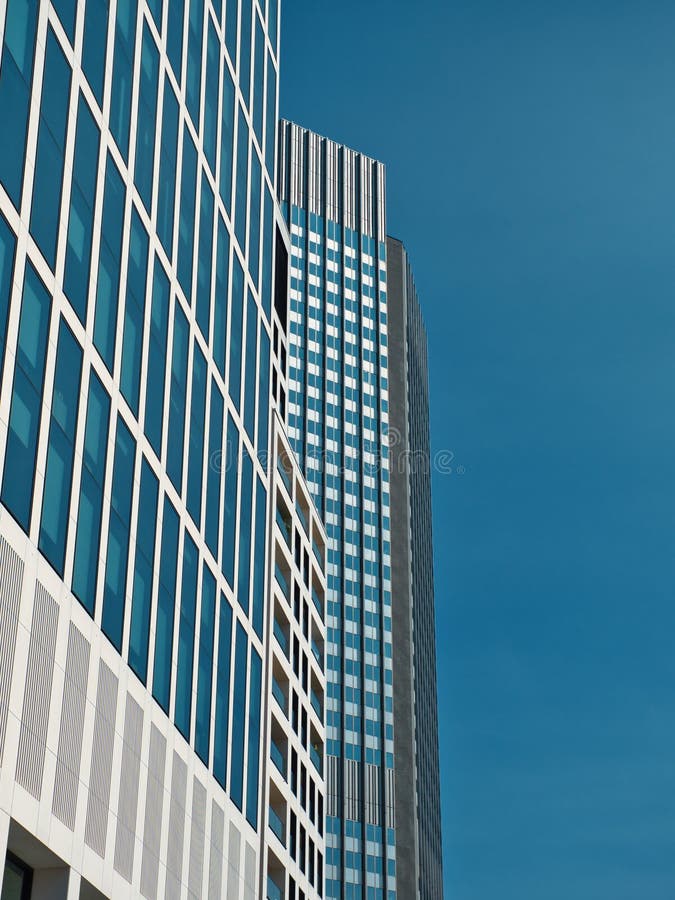 A Facade of a Skyscraper with Large Windows and a Blue Sky Stock Photo ...