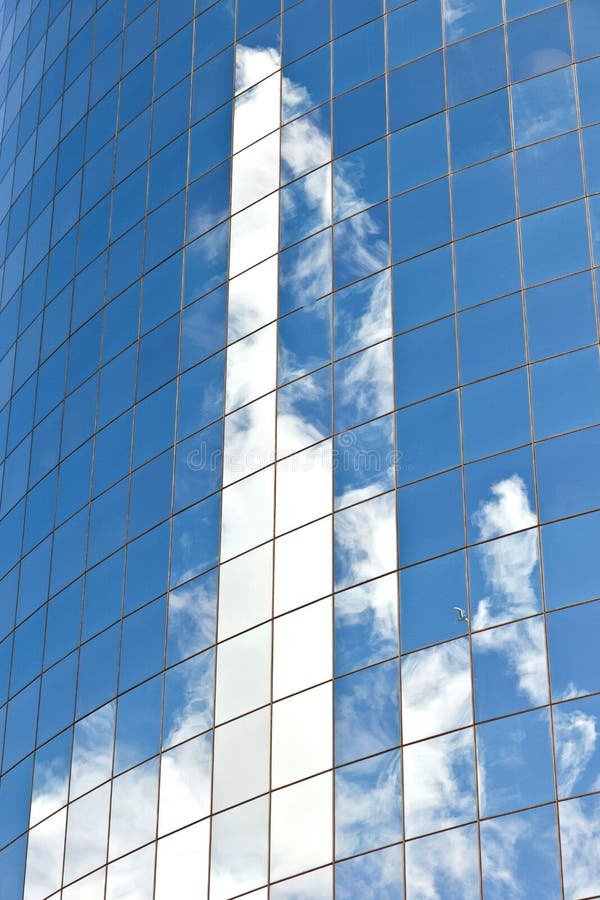 Facade of Skyscraper with Reflection of Sky Stock Photo - Image of ...