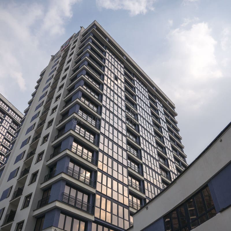 Facade of a Tall Building with Reflection in the Windows Stock Photo ...