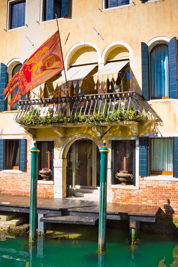 Facade of Typical Medieval House with Flag on Canal, Venice, Italy ...