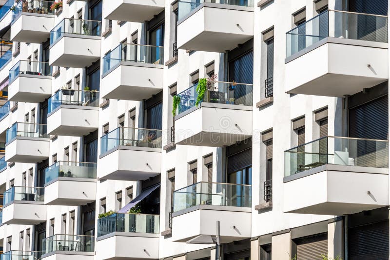 Facade of a White Modern Apartment Building with Small Balconies Stock ...