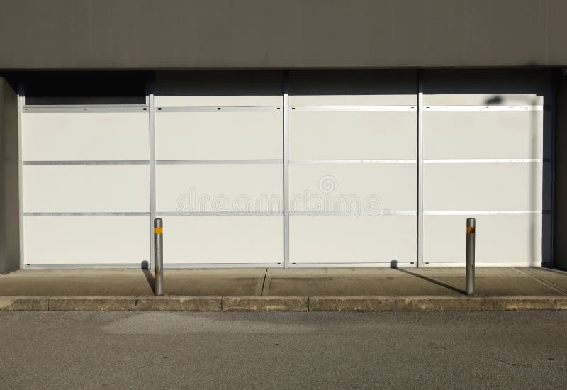 Facade with White Veiled Windows at Floor Level. Concrete Sidewalk with ...
