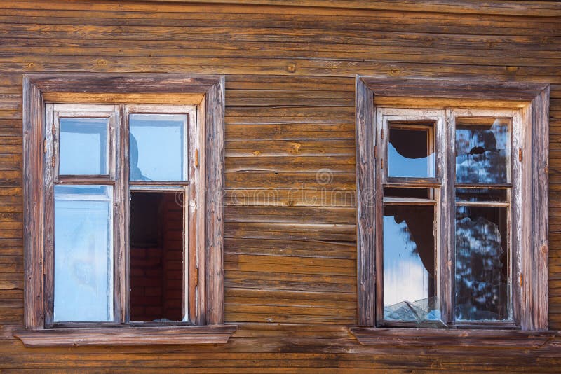 Facade of a Wooden Abandoned Residential Building with Broken Windows ...