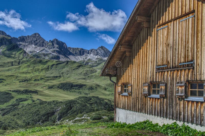 Facade of a Wooden House in the Alps Stock Photo - Image of cliff, hill ...