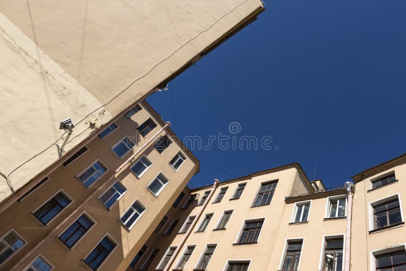 Facade of the Yellow Building with Windows, the Outer Highrise Building ...
