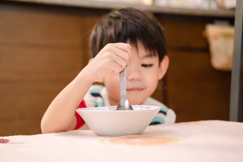 The Face of an Asian Child Eating Rice Stock Photo - Image of home ...