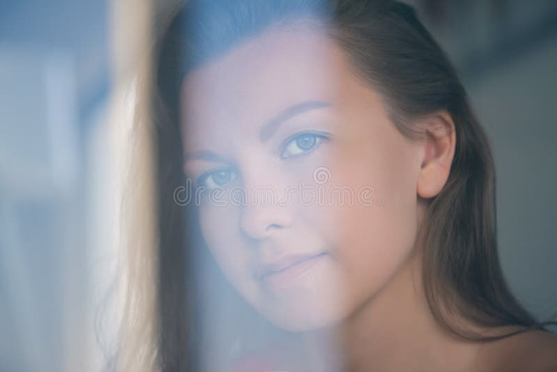 Face of Attractive Young Woman Behind the Glass Stock Photo - Image of ...