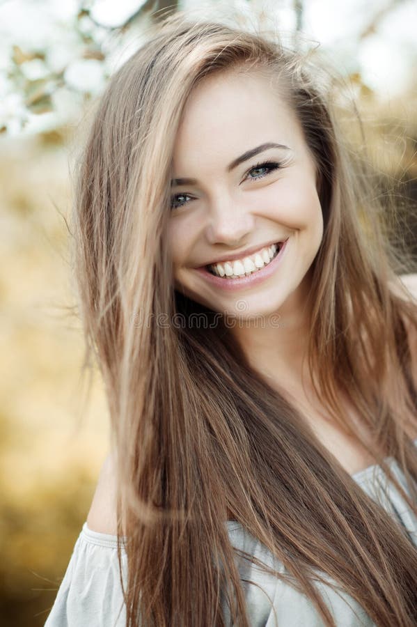 Face Of A Beautiful Young Smiling Girl Close Up Stock Image Image