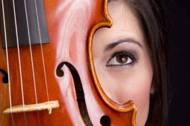 Female Face Behind Violin Stringed Instrument Stock Photo - Image of ...