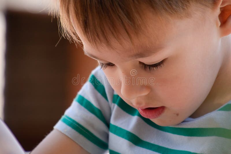 The Face of the Boy Looking Down. Stock Photo - Image of individual ...