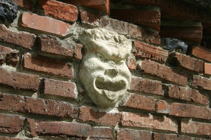 Face in the bricks stock image. Image of chiseled, wall - 82401