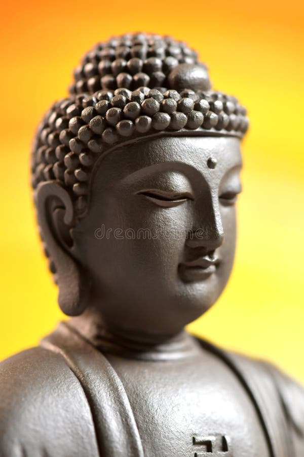 The Face of Buddha Zen Sculpture on a Yellow Background Stock Photo ...
