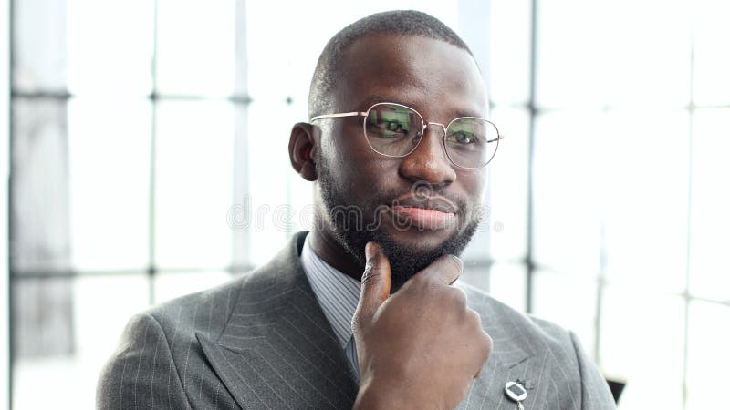 The Face of a Businessman Man in Close-up, he is Thinking in the Office ...
