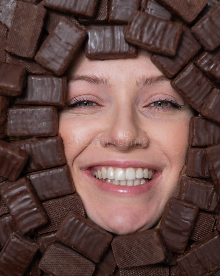 The Face of a Caucasian Woman Surrounded by Sweets. the Girl is Smeared ...