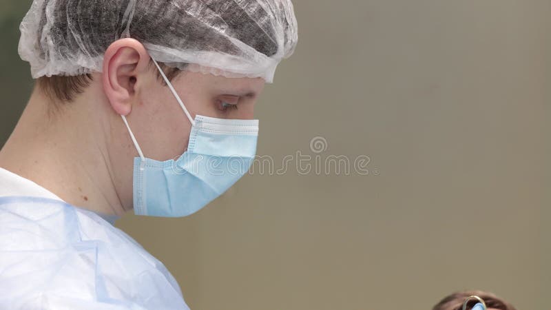 Face of a Doctor Wearing a Mask while Working Stock Video - Video of ...