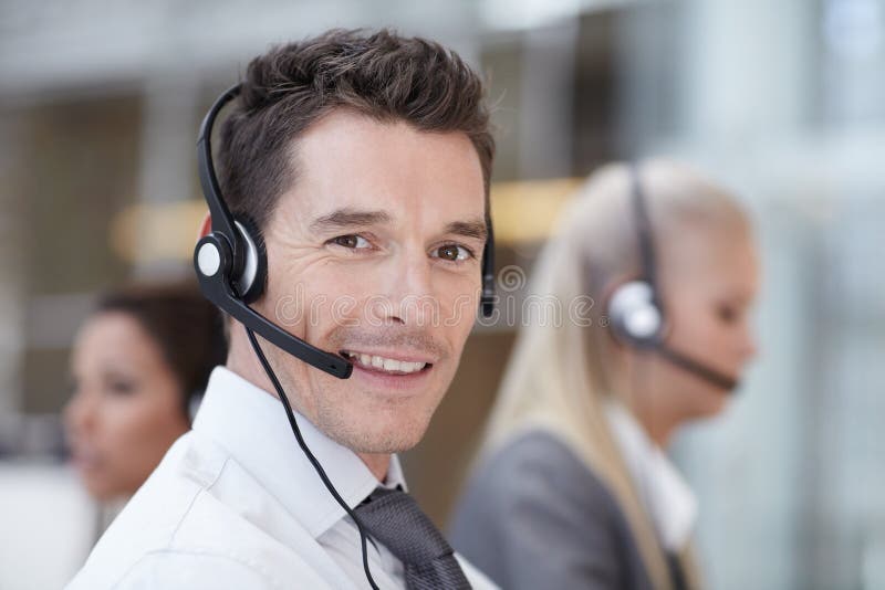 The Face of Efficiency. a Handsome Customer Service Representative ...
