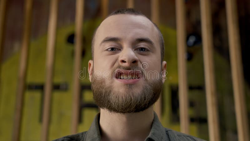 Face of Funny Young Guy with Beard. Guy is Smiling. Handsome Guy Turns ...