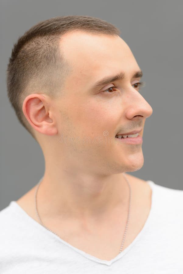 Face of Happy Handsome Man Thinking Against Gray Wall Stock Image ...