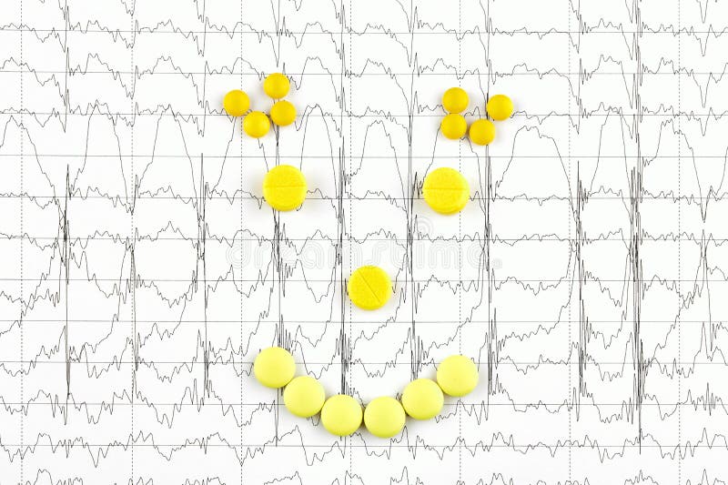 Face Made of Yellow Pills on EKG Graph. Medicine Stock Image - Image of ...