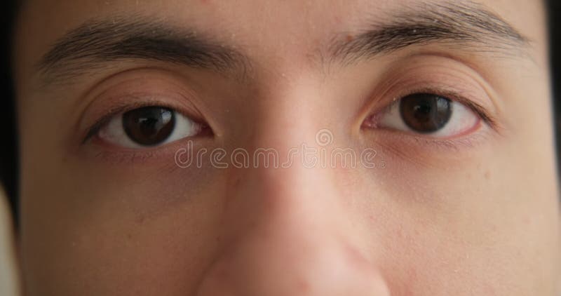 Face of man blinking eyes stock footage. Video of skin - 205232126