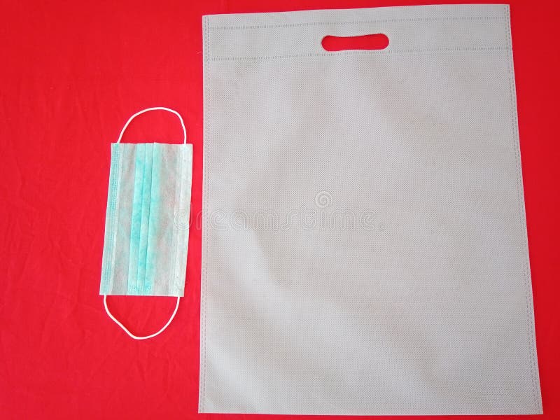 Face mask and bag on red stock photo. Image of tote - 177575344