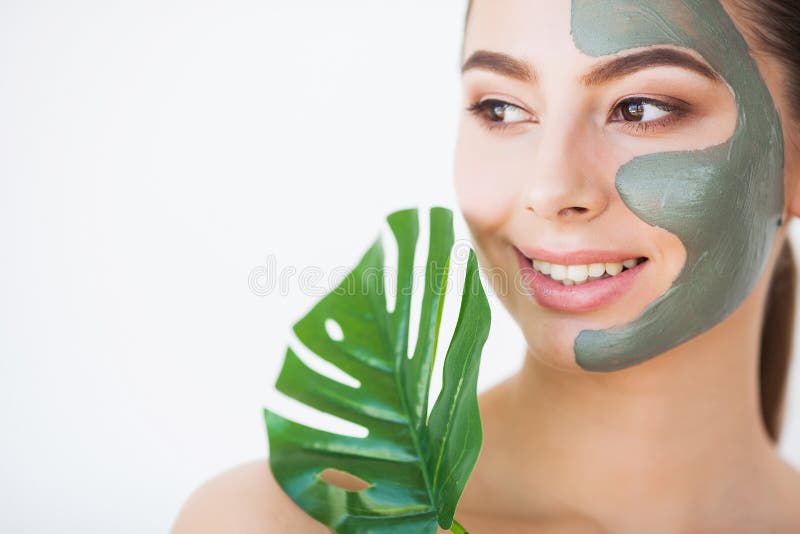 Face Mask. Beautiful Smiling Woman Applying Mask on Face Stock Image ...
