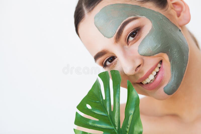 Face Mask. Beautiful Smiling Woman Applying Mask on Face Stock Image ...