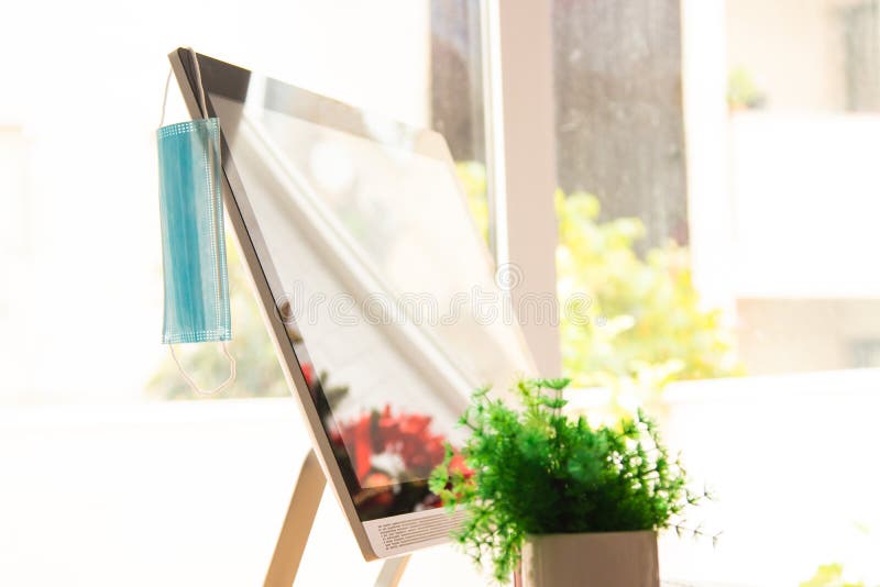 Face Mask on Computer Screen in Office Stock Photo - Image of health ...