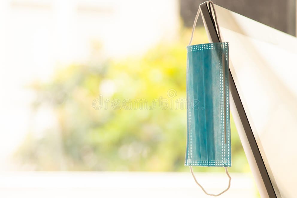 Face Mask on Computer Screen in Office Stock Image - Image of ...