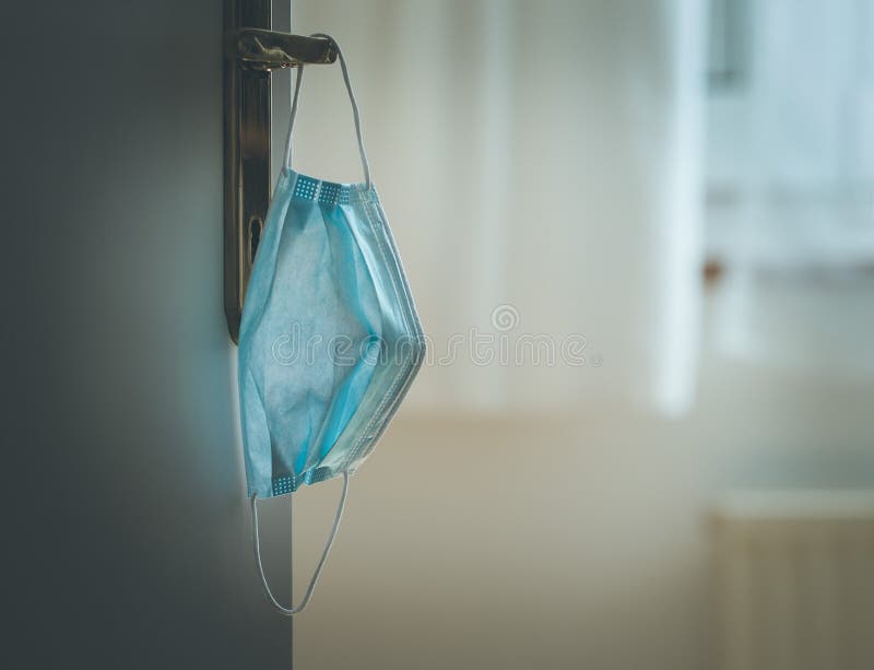 Face Mask Concept: Surgical Mask on at Home, Door Handle Stock Image ...