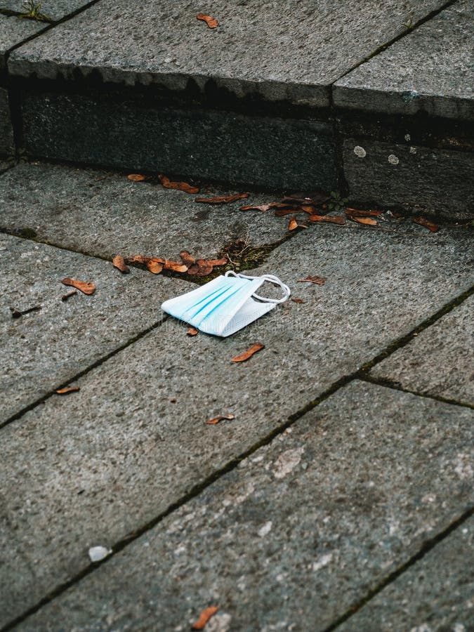 Face Mask Fallen on the Ground - the New Normal Concept Stock Image ...