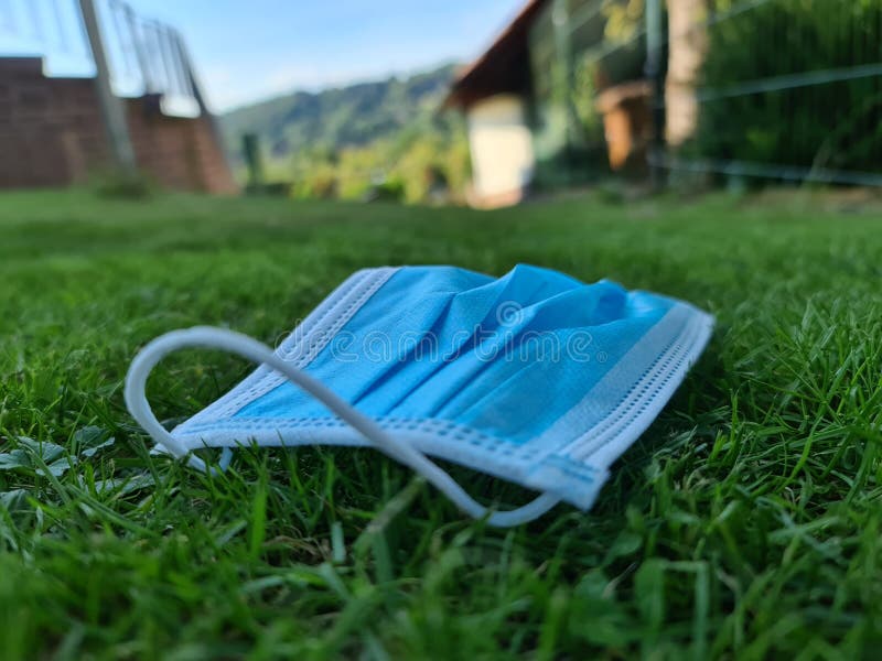 Face mask in a Gras field stock photo. Image of sunlight - 192235724