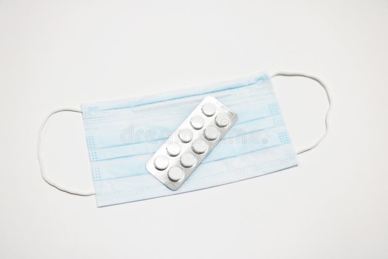 A Face Mask and White Tablets. Coronavirus Concept Stock Image - Image ...