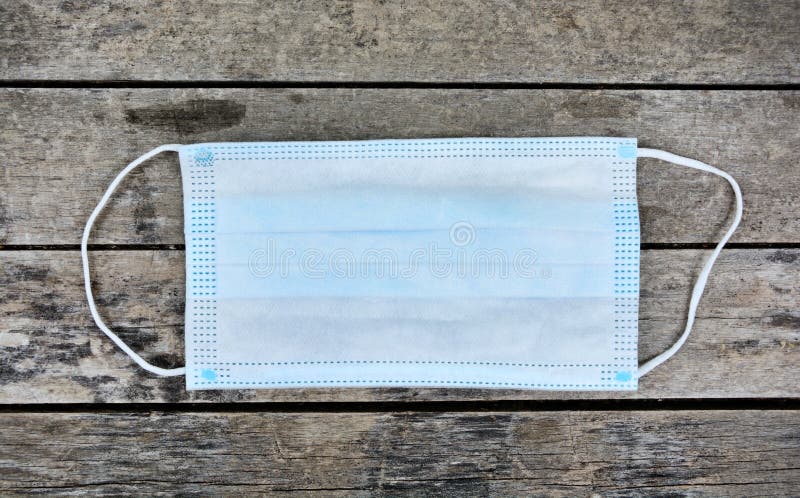 Face Mask on a Wooden Table Stock Image - Image of danger, surgical ...